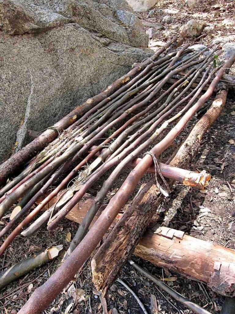 How to make a DIY bed in the wild - American Outdoor Guide